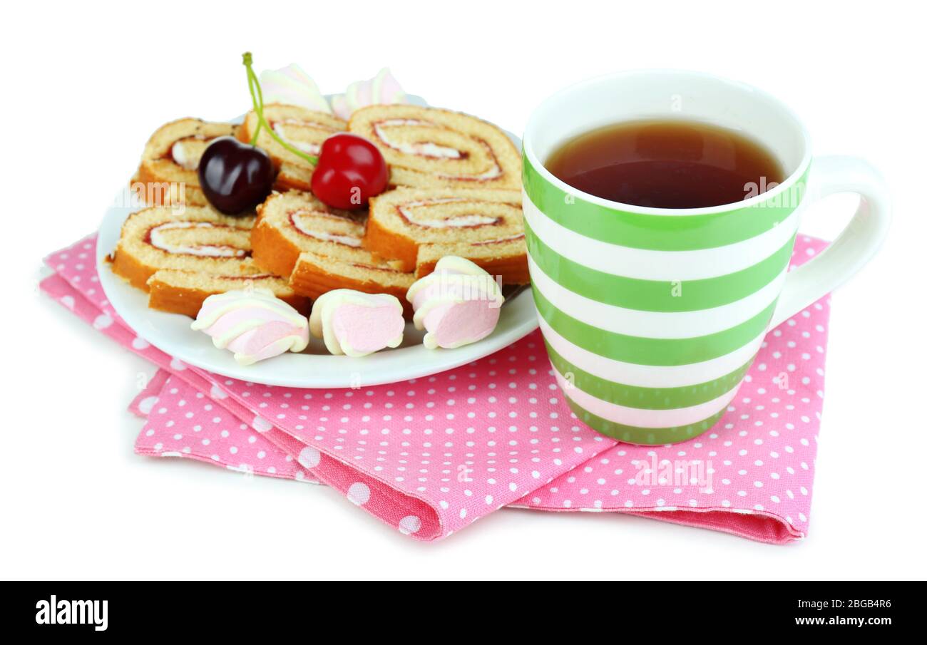 Cup of tea and sweets isolated on white Stock Photo - Alamy