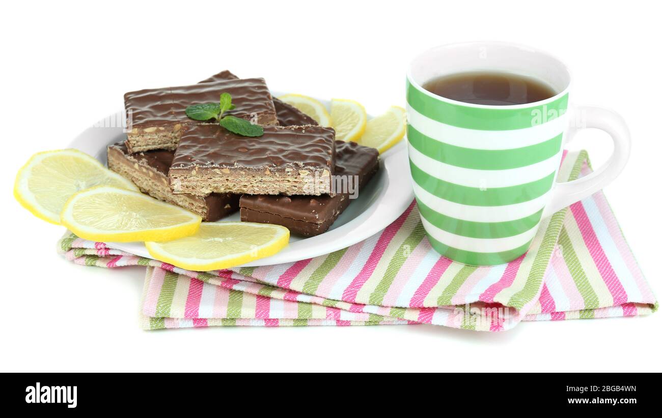 Cup of tea and sweets isolated on white Stock Photo - Alamy