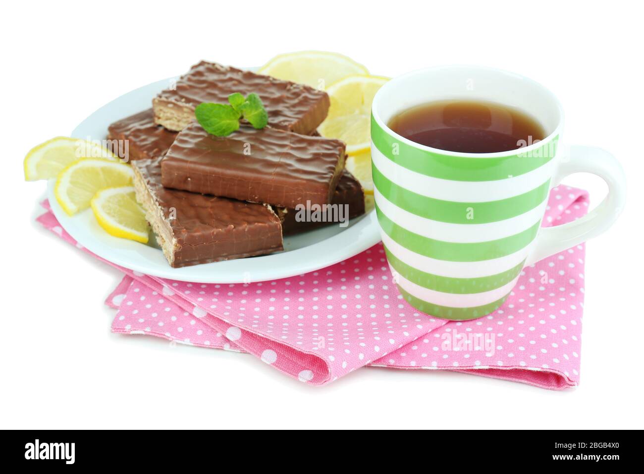 Cup of tea and sweets isolated on white Stock Photo - Alamy