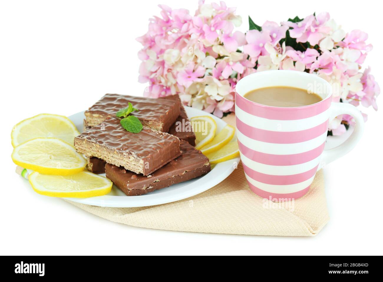 Cup of tea and sweets isolated on white Stock Photo - Alamy