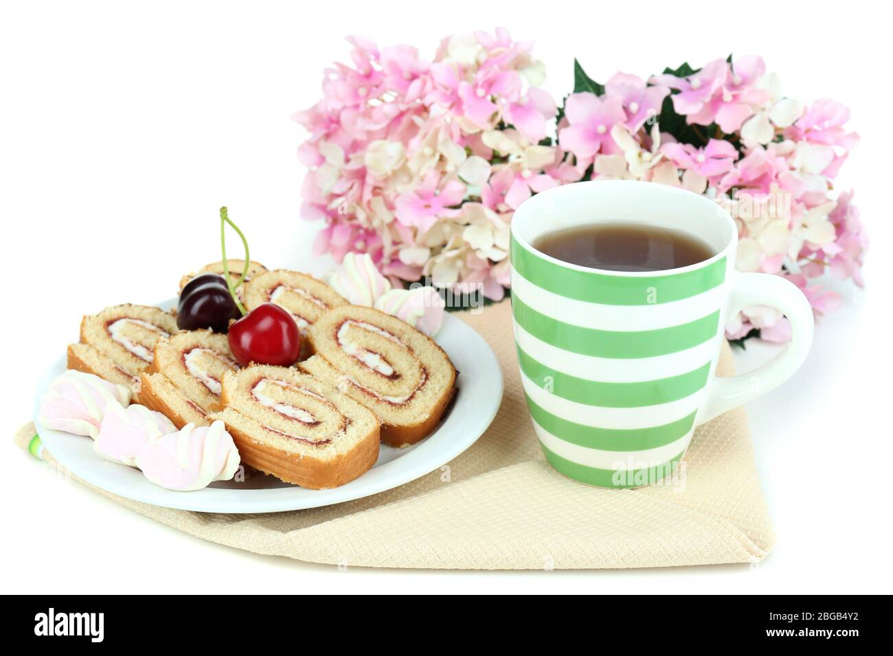 Cup of tea and sweets isolated on white Stock Photo - Alamy