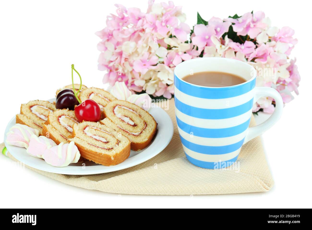 Cup of tea and sweets isolated on white Stock Photo - Alamy