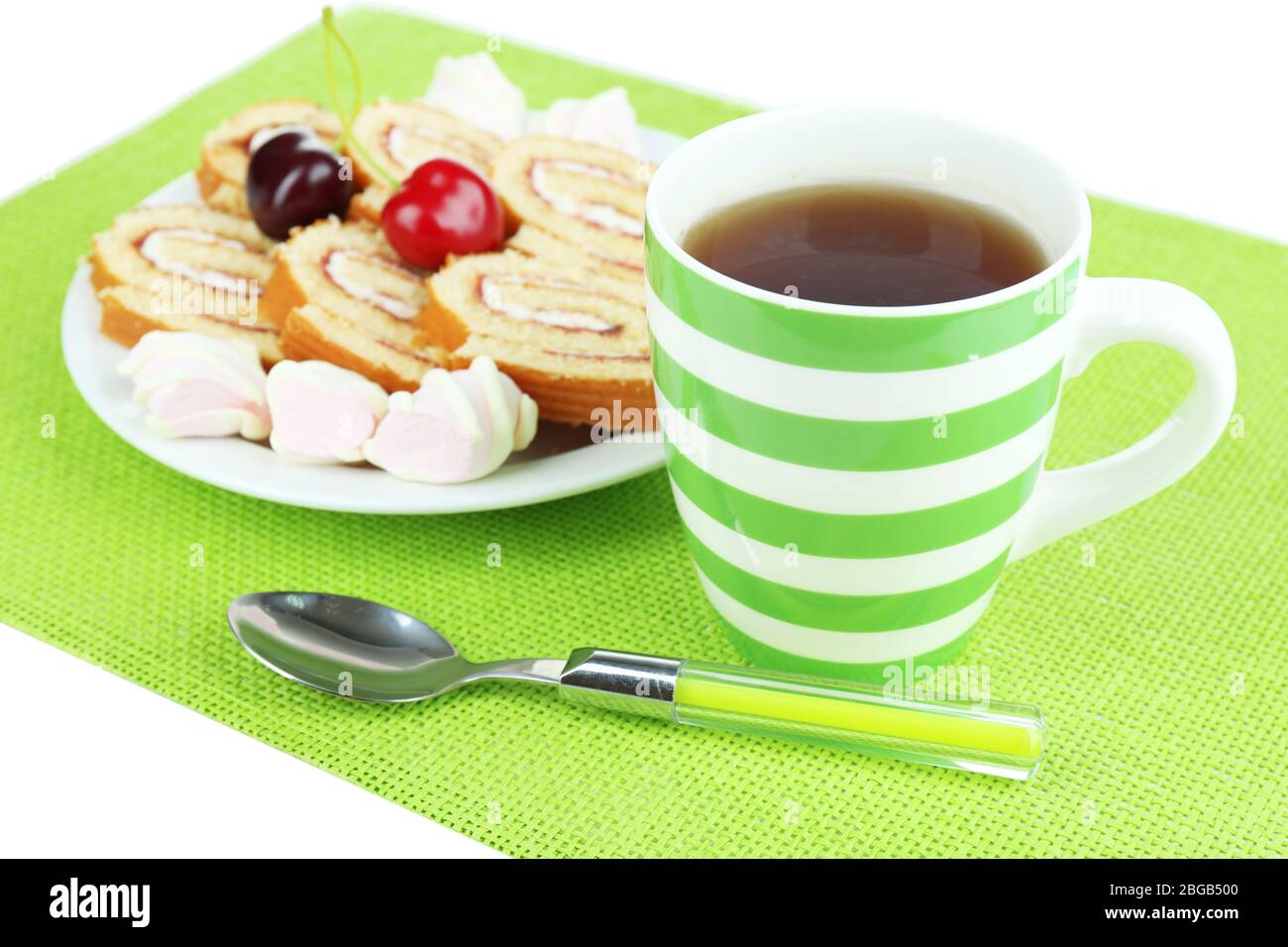Cup of tea and sweets isolated on white Stock Photo - Alamy