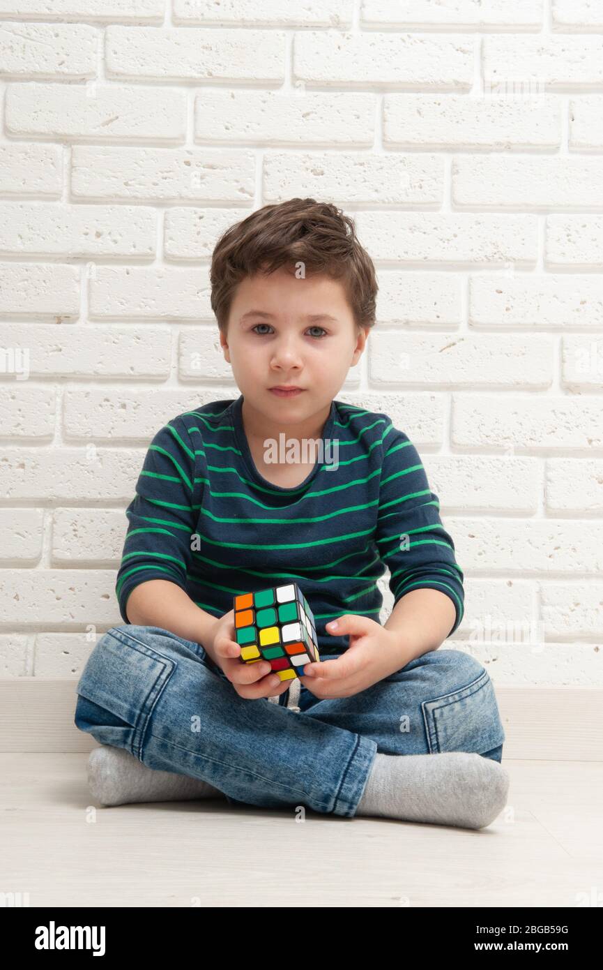 Kiev, Ukraine, 22 march 2020. boy plays with rubik's cube. Rubik's Cube ...