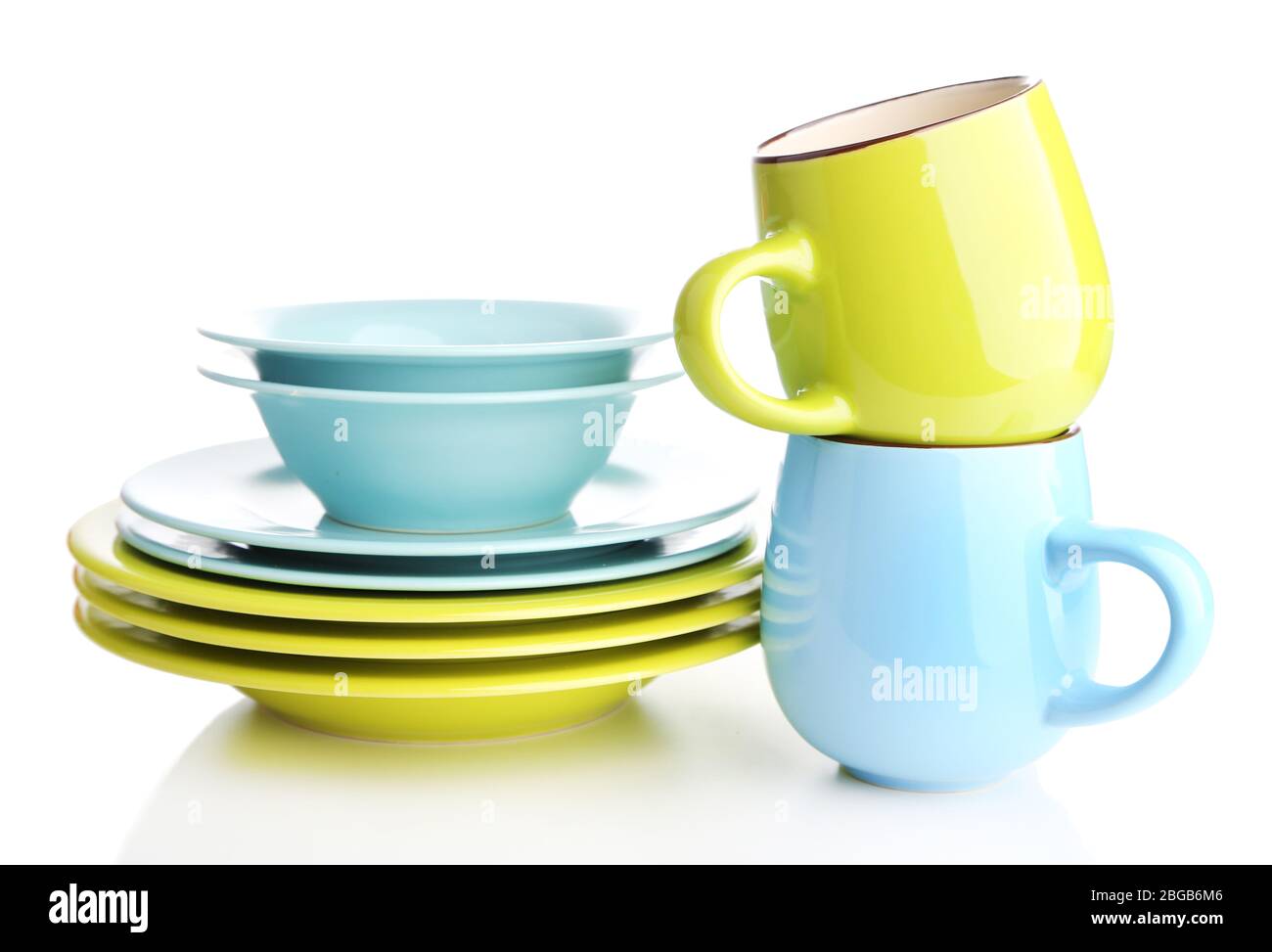 Clean colorful tableware isolated on white Stock Photo - Alamy