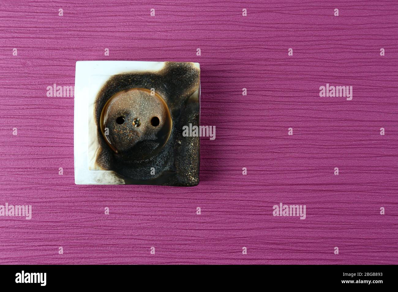 Burned plug socket close up Stock Photo - Alamy