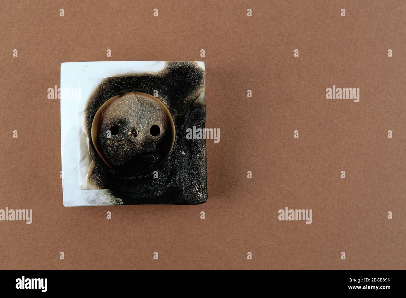 Burned plug socket close up Stock Photo - Alamy