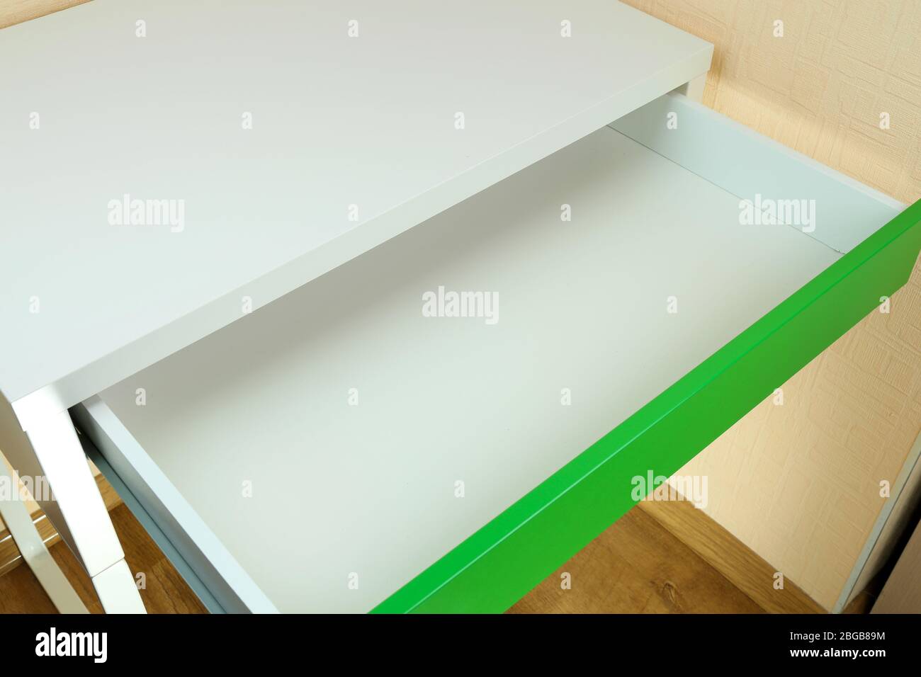 Table with opened empty drawer Stock Photo - Alamy