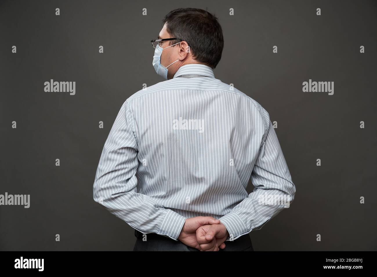 Backside view man in mask hi-res stock photography and images - Alamy