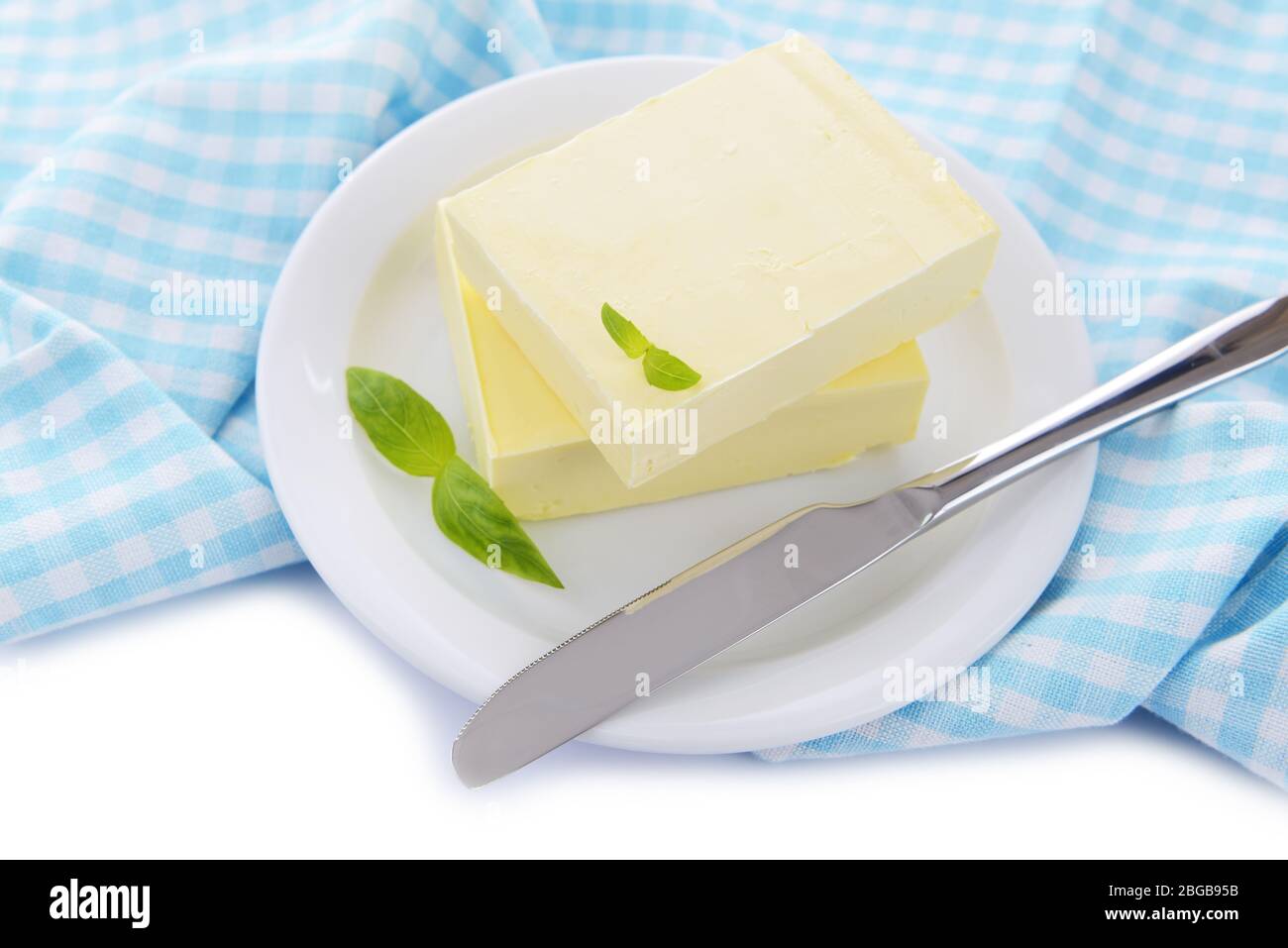 Tasty butter on plate, isolated on white Stock Photo - Alamy