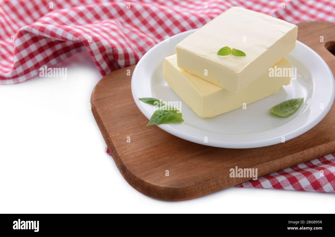 Tasty butter on plate, isolated on white Stock Photo - Alamy