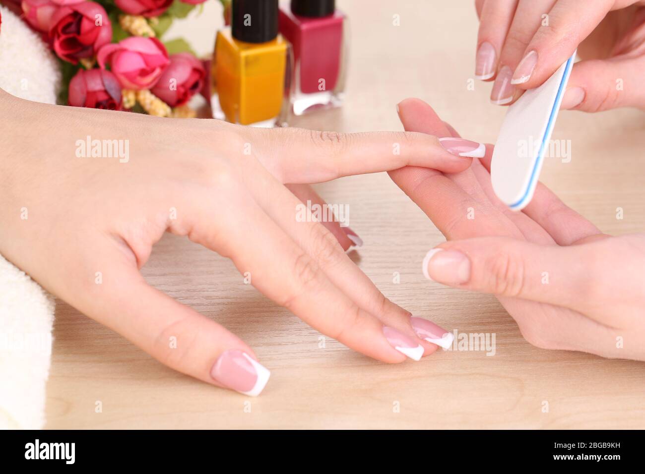 Manicure process in beauty salon close up Stock Photo - Alamy