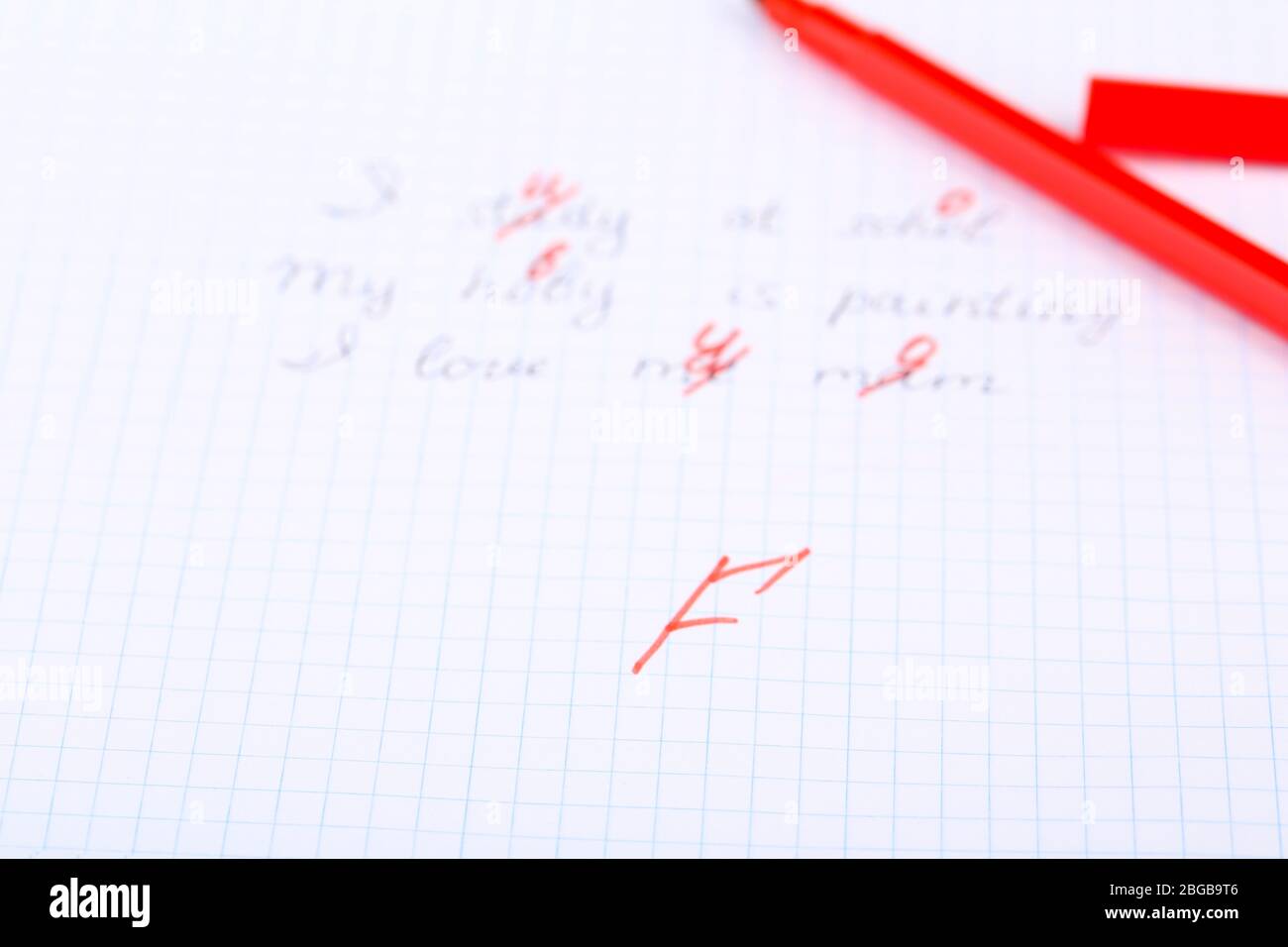 Grade written on an exam paper, close-up Stock Photo - Alamy