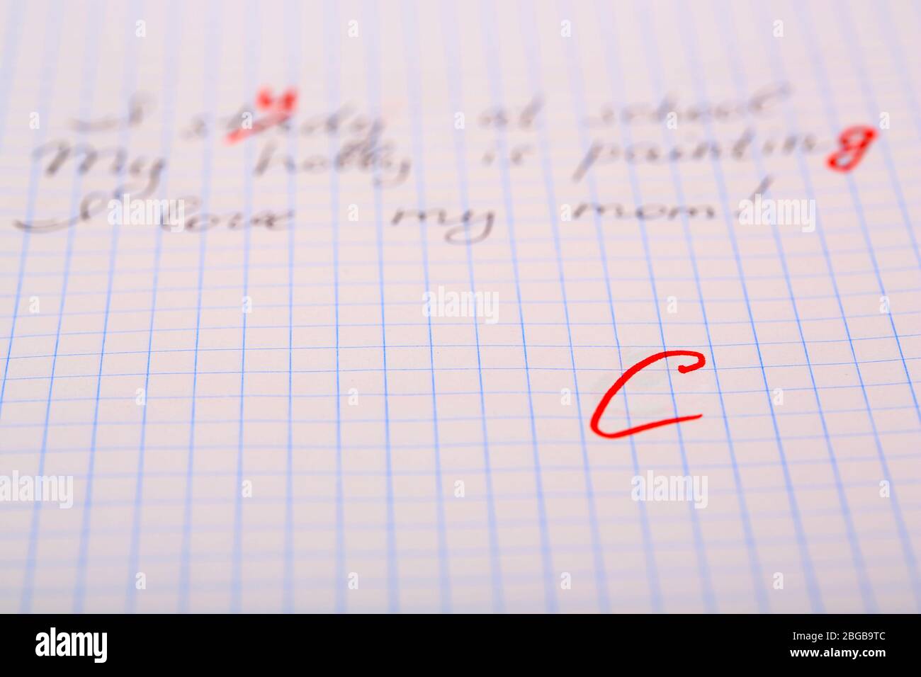Grade written on an exam paper, close-up Stock Photo - Alamy
