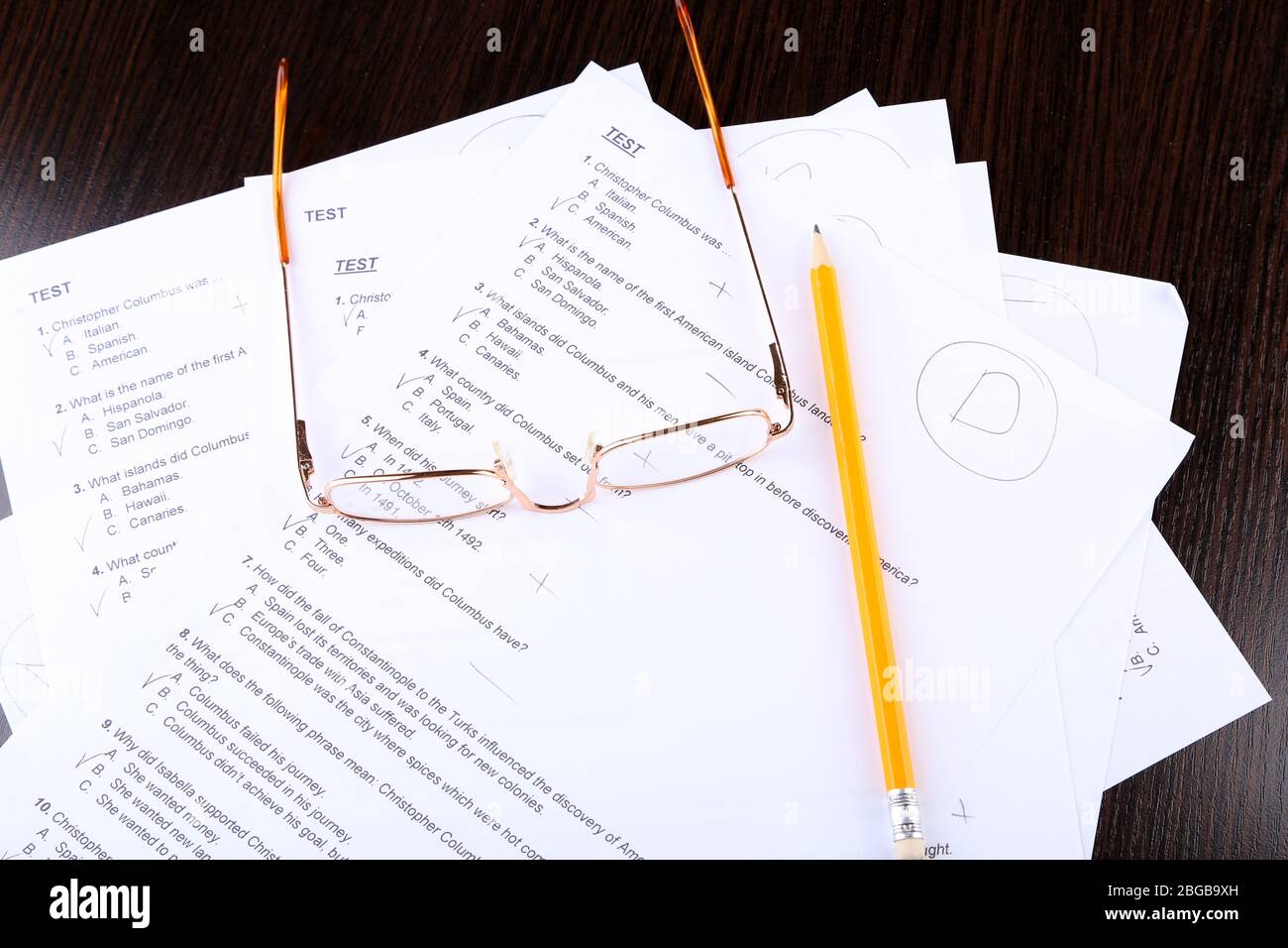 Grade written on an exam paper, close-up Stock Photo - Alamy