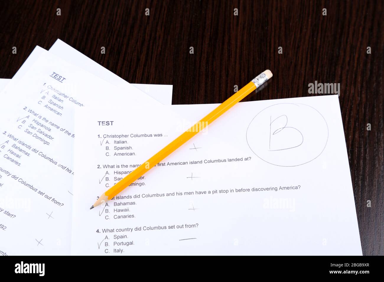 Grade written on an exam paper, close-up Stock Photo - Alamy