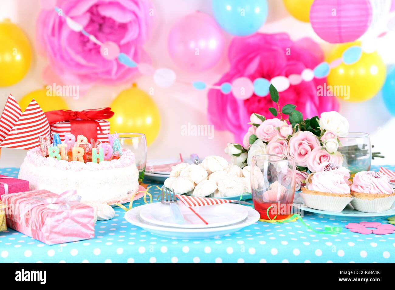 Festive table setting for birthday on celebratory decorations Stock ...