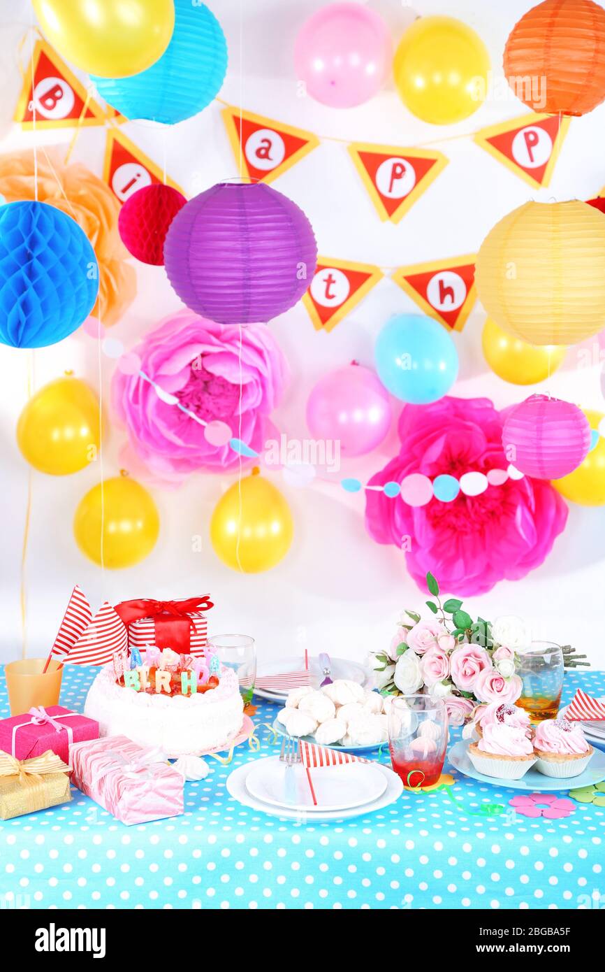 Festive table setting for birthday on celebratory decorations Stock ...