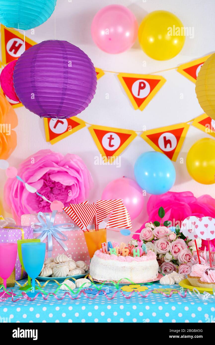 Festive table setting for birthday on celebratory decorations Stock ...