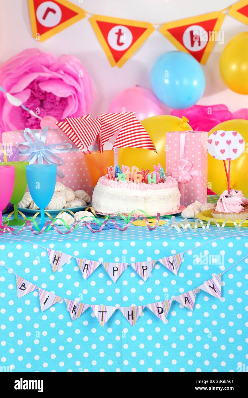 Festive table setting for birthday on celebratory decorations Stock ...