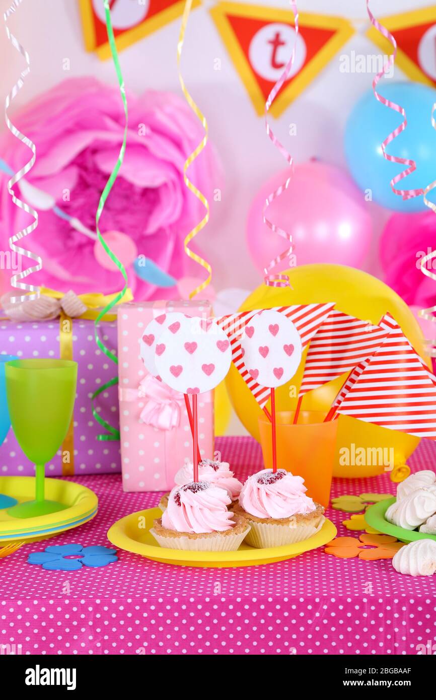 Festive table setting for birthday on celebratory decorations Stock ...