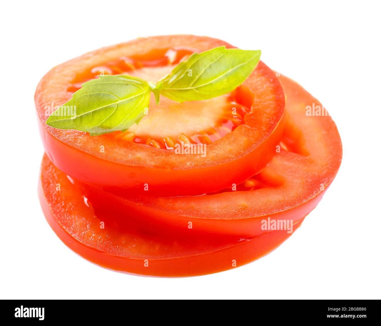 Slices of fresh tomato with basil, isolated on white Stock Photo - Alamy