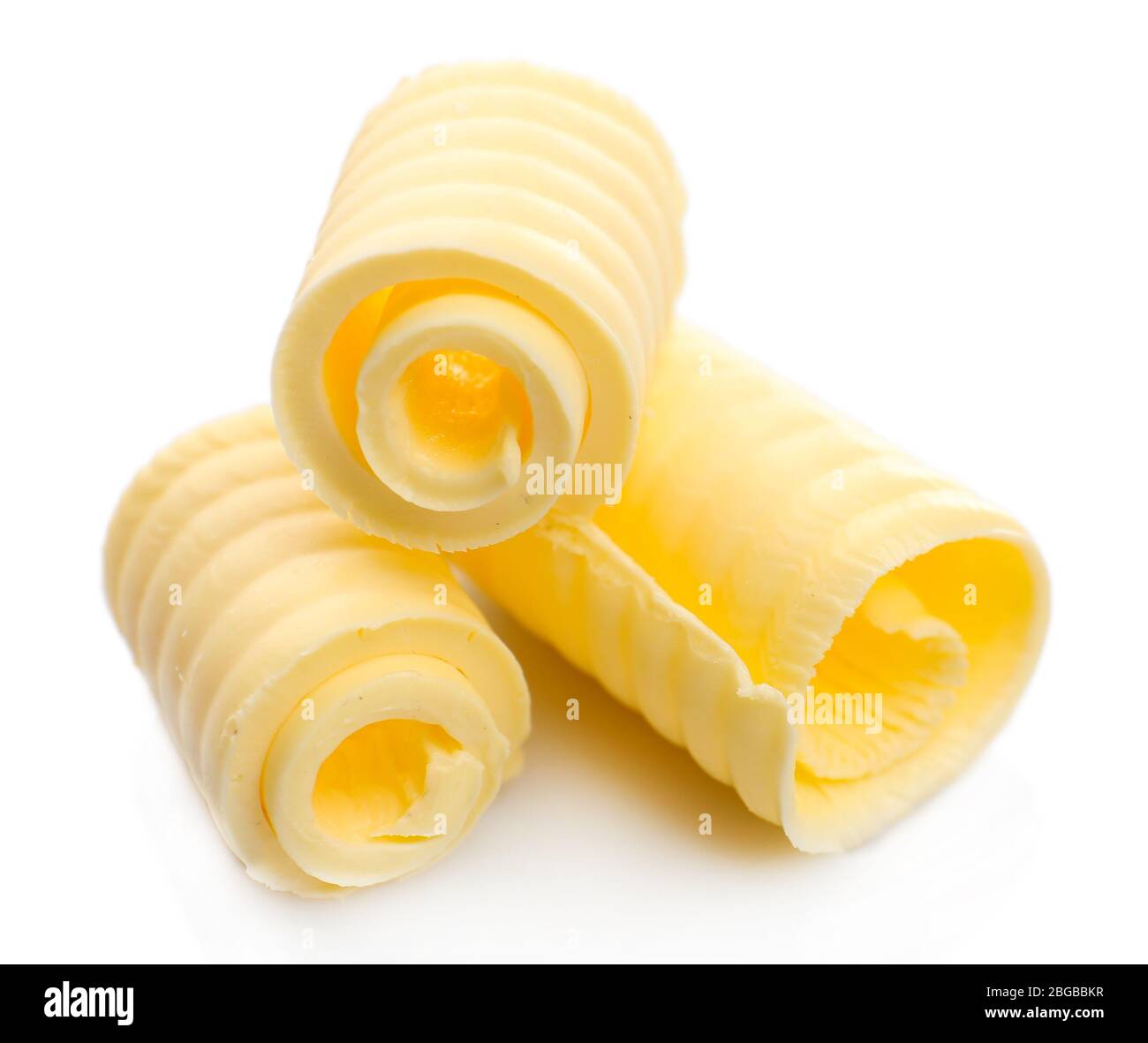 Curls of fresh butter, isolated on white Stock Photo - Alamy