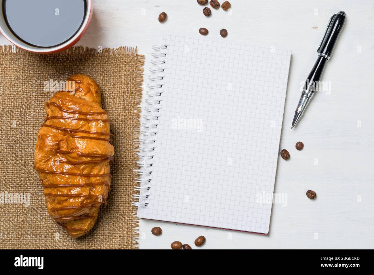 Coffee break with snack Stock Photo - Alamy