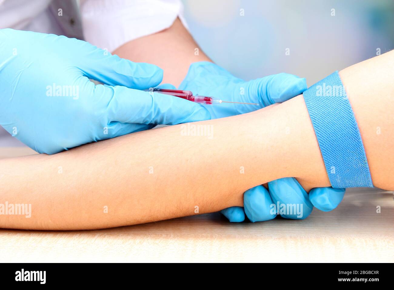Nurse taking a blood sample, close up Stock Photo - Alamy