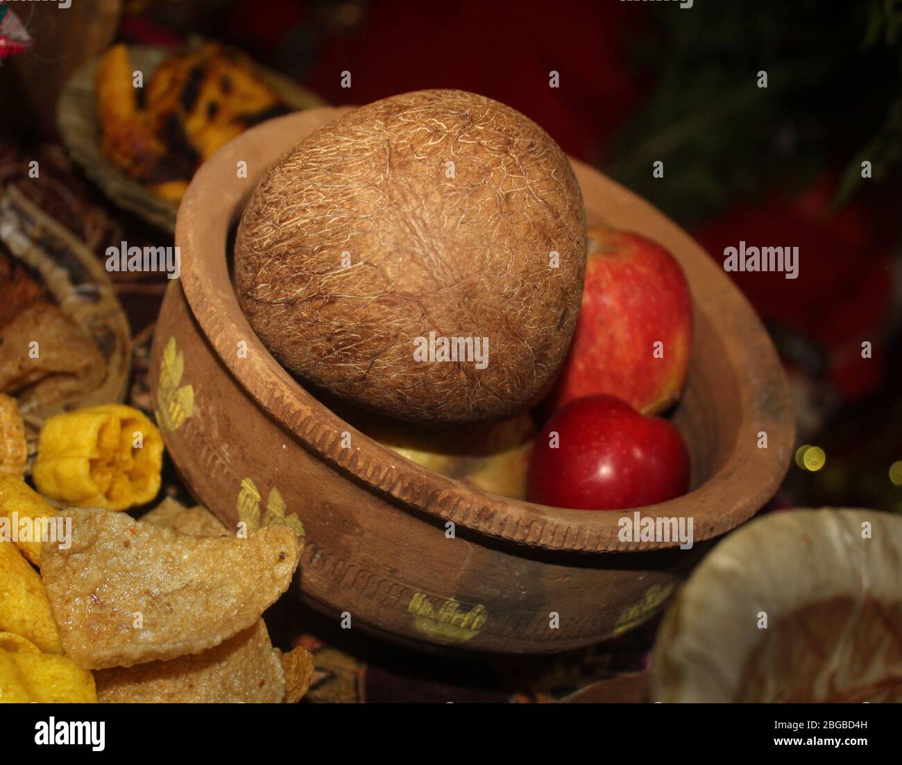 coconut,apple fruits served in Mud bowl with a typical Indian fruits ...