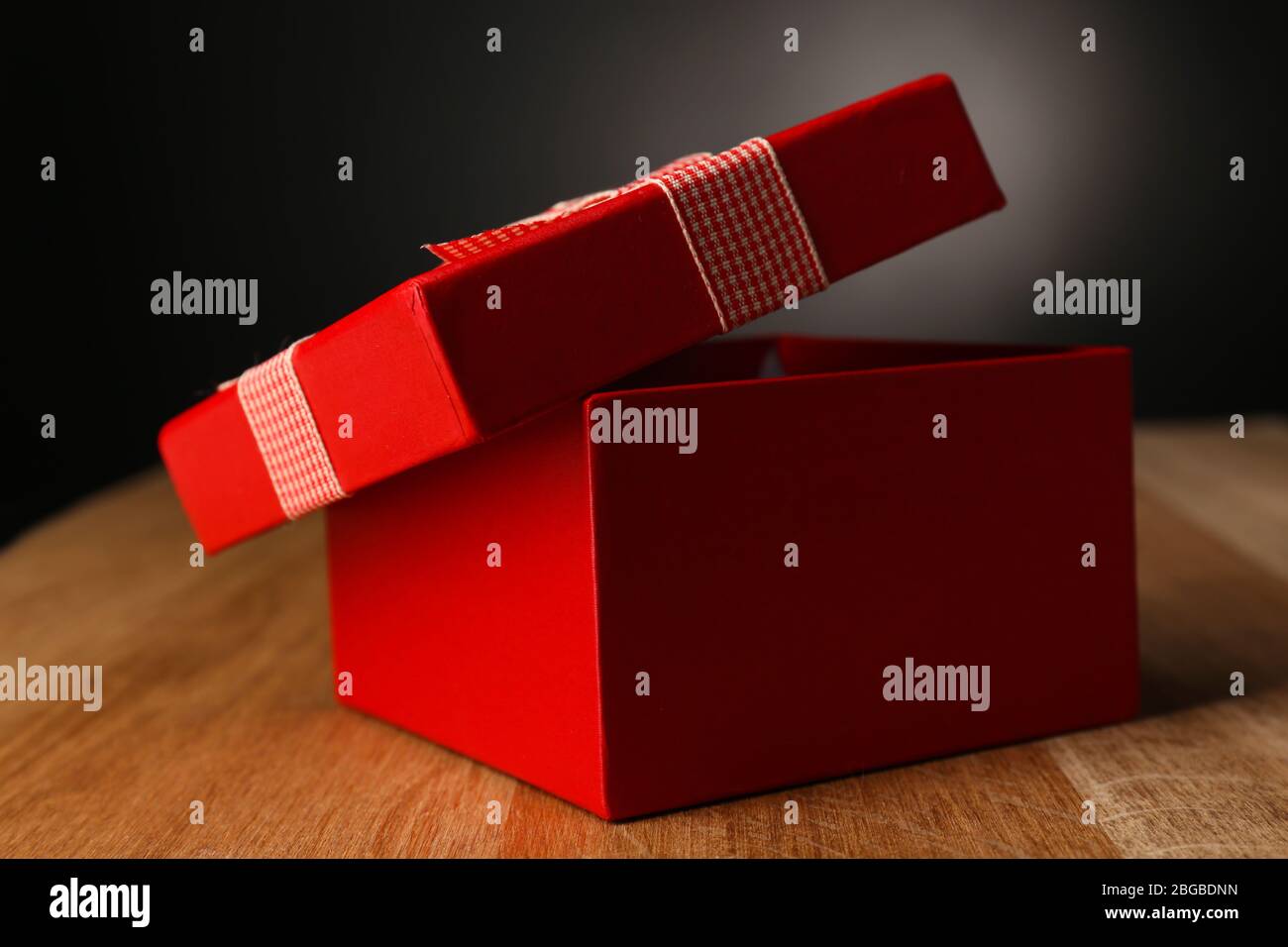 Open gift box on dark background Stock Photo - Alamy