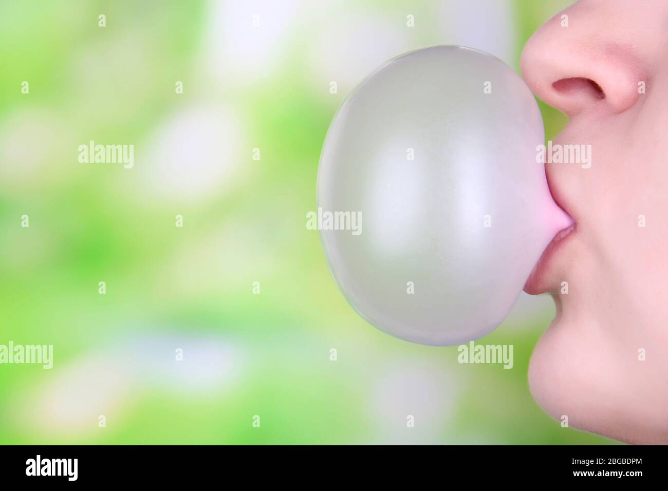 Girl blowing huge bubble pink hi-res stock photography and images - Alamy
