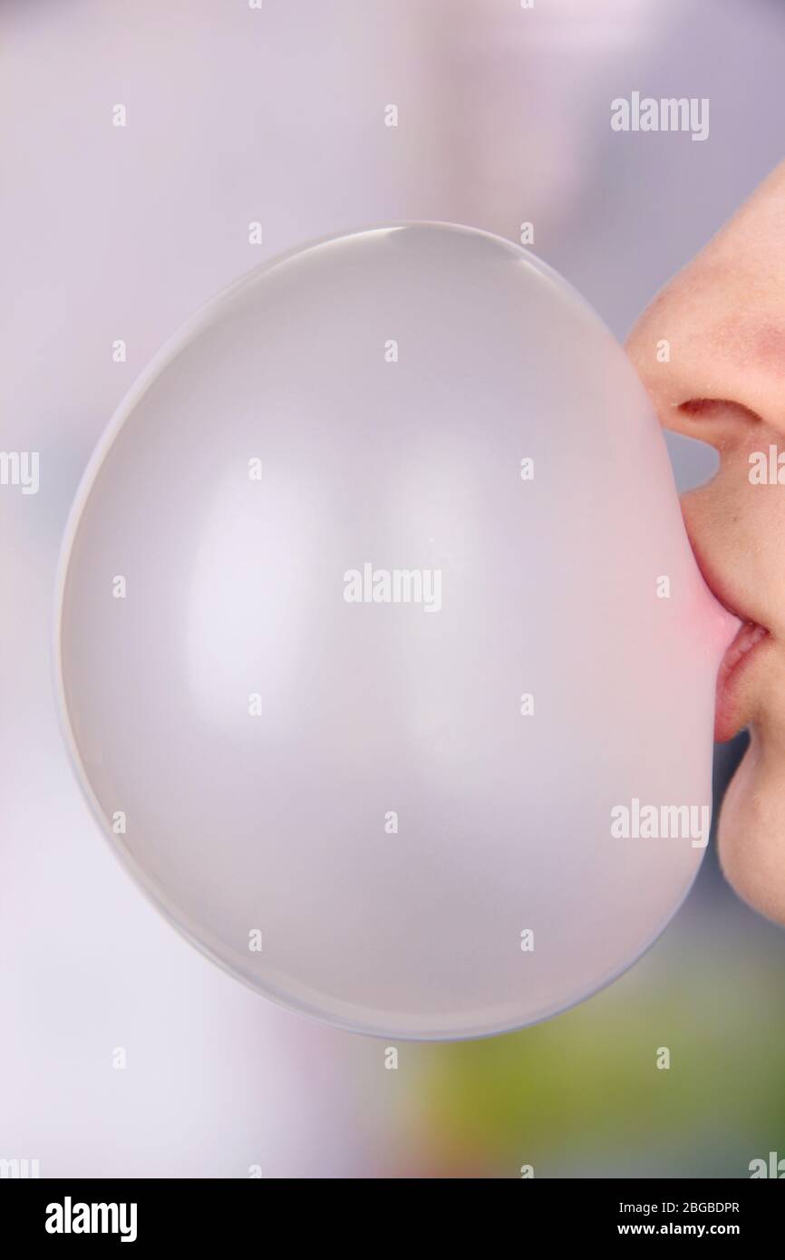 Girl blowing huge bubble pink hi-res stock photography and images - Alamy