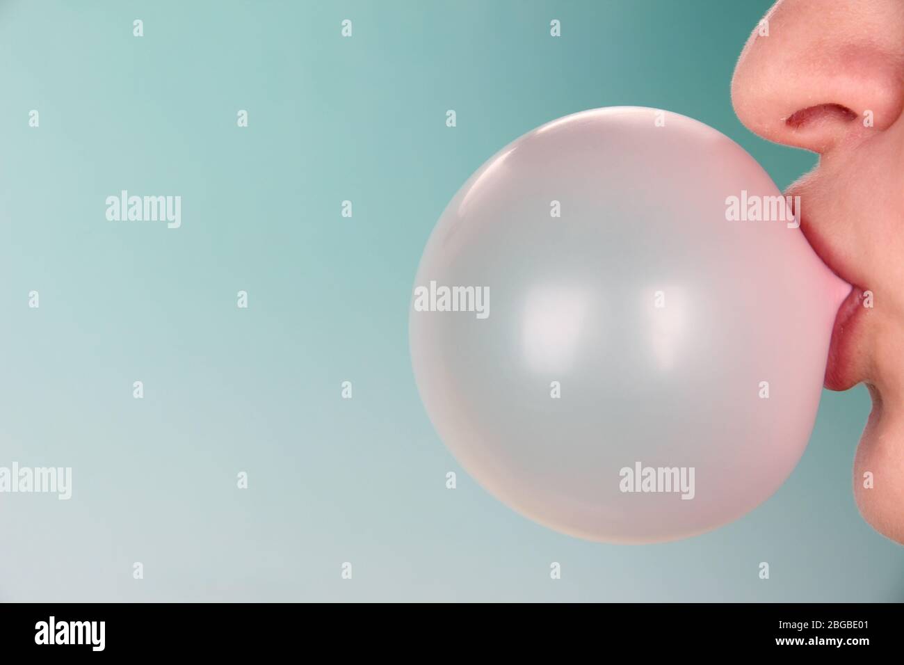 Woman blowing big bubble gum hi-res stock photography and images - Alamy