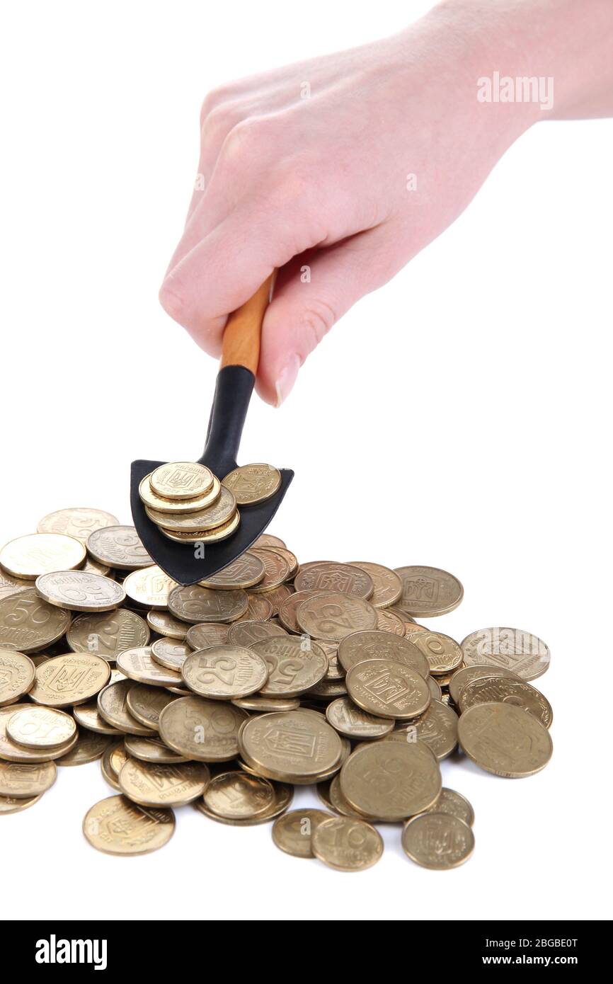 Hand holding shovel with coins isolated on white Stock Photo - Alamy