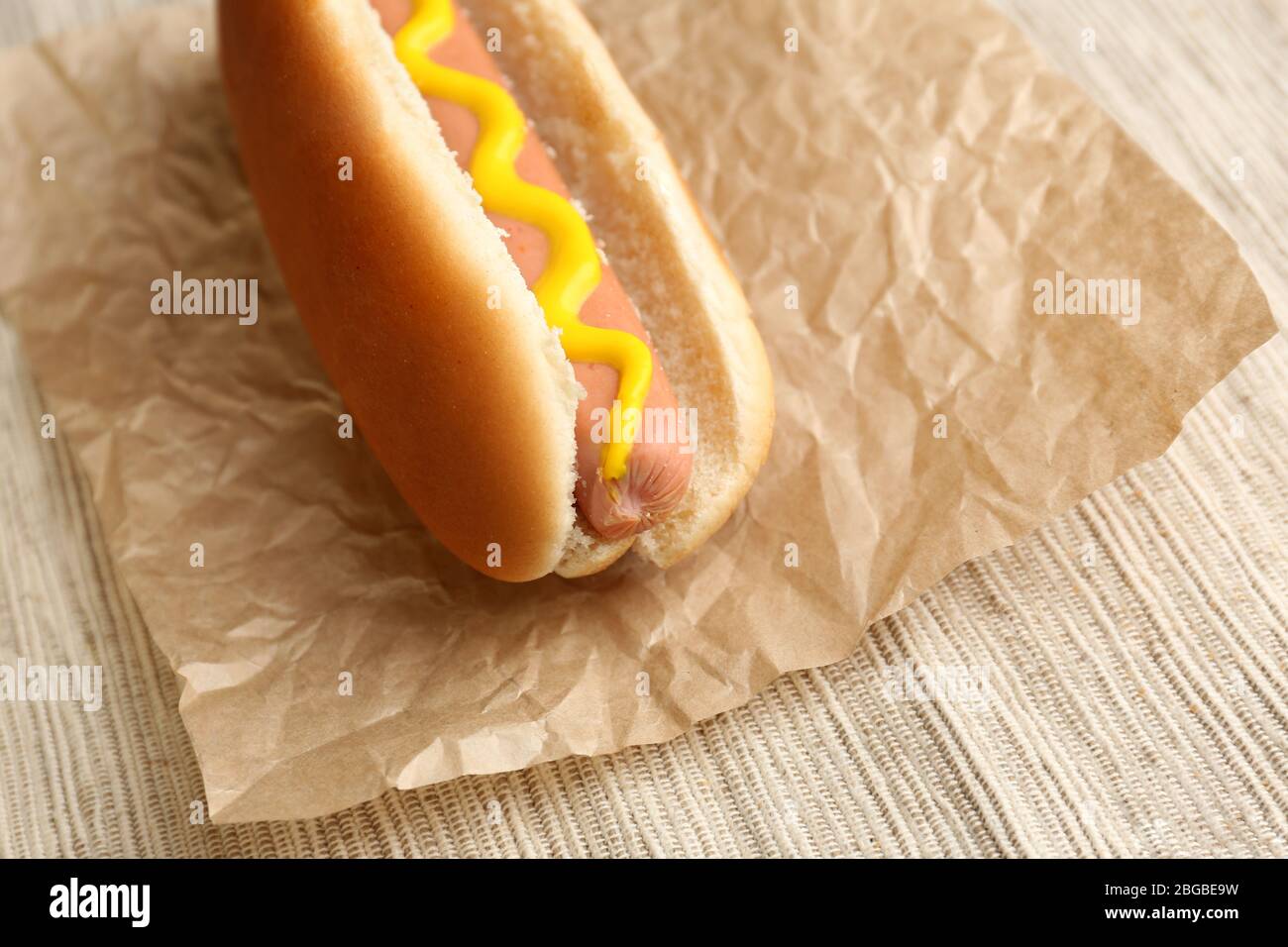 Tasty hot dog on paper Stock Photo - Alamy