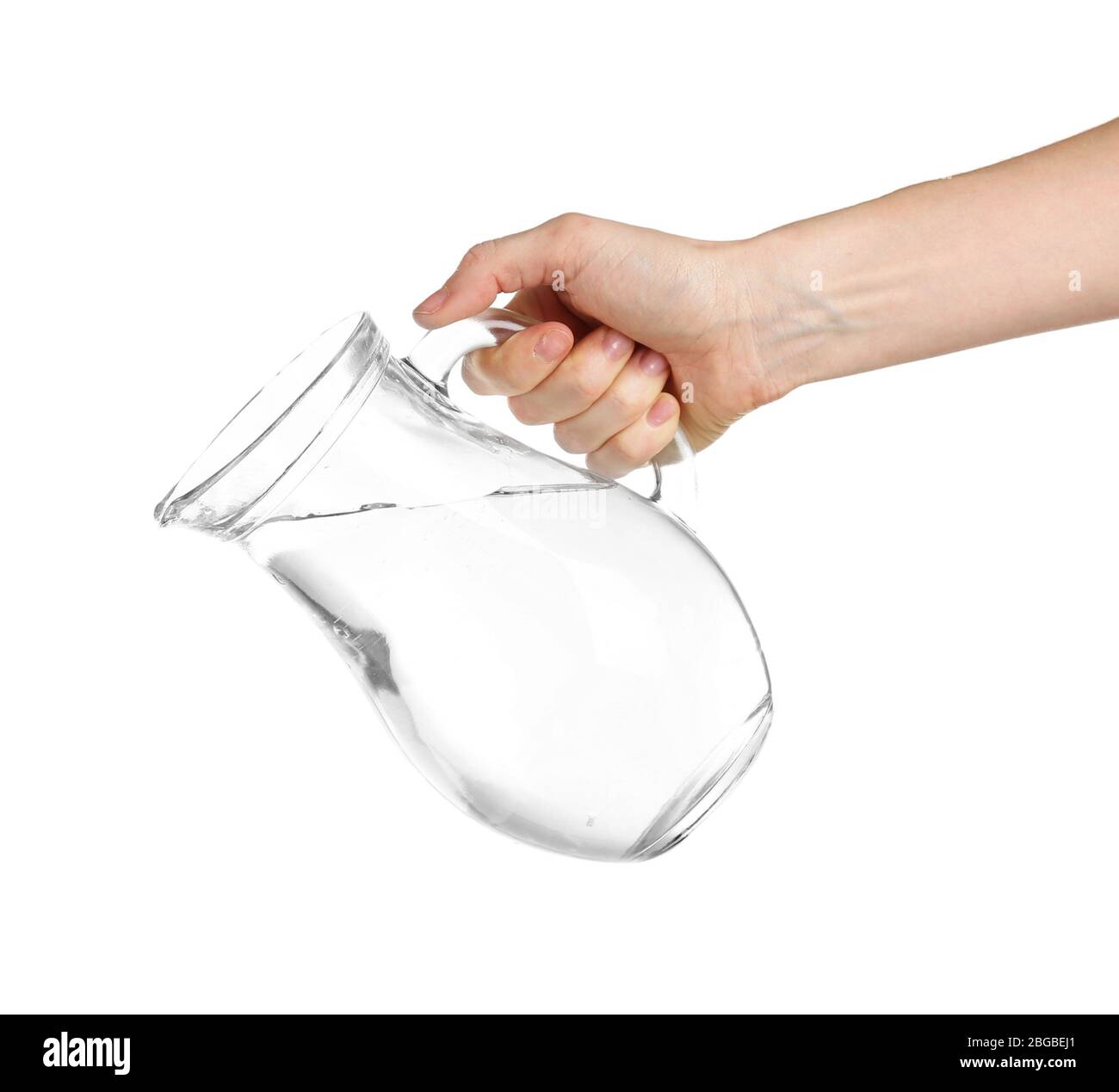 Pouring water from glass pitcher, isolated on white Stock Photo - Alamy