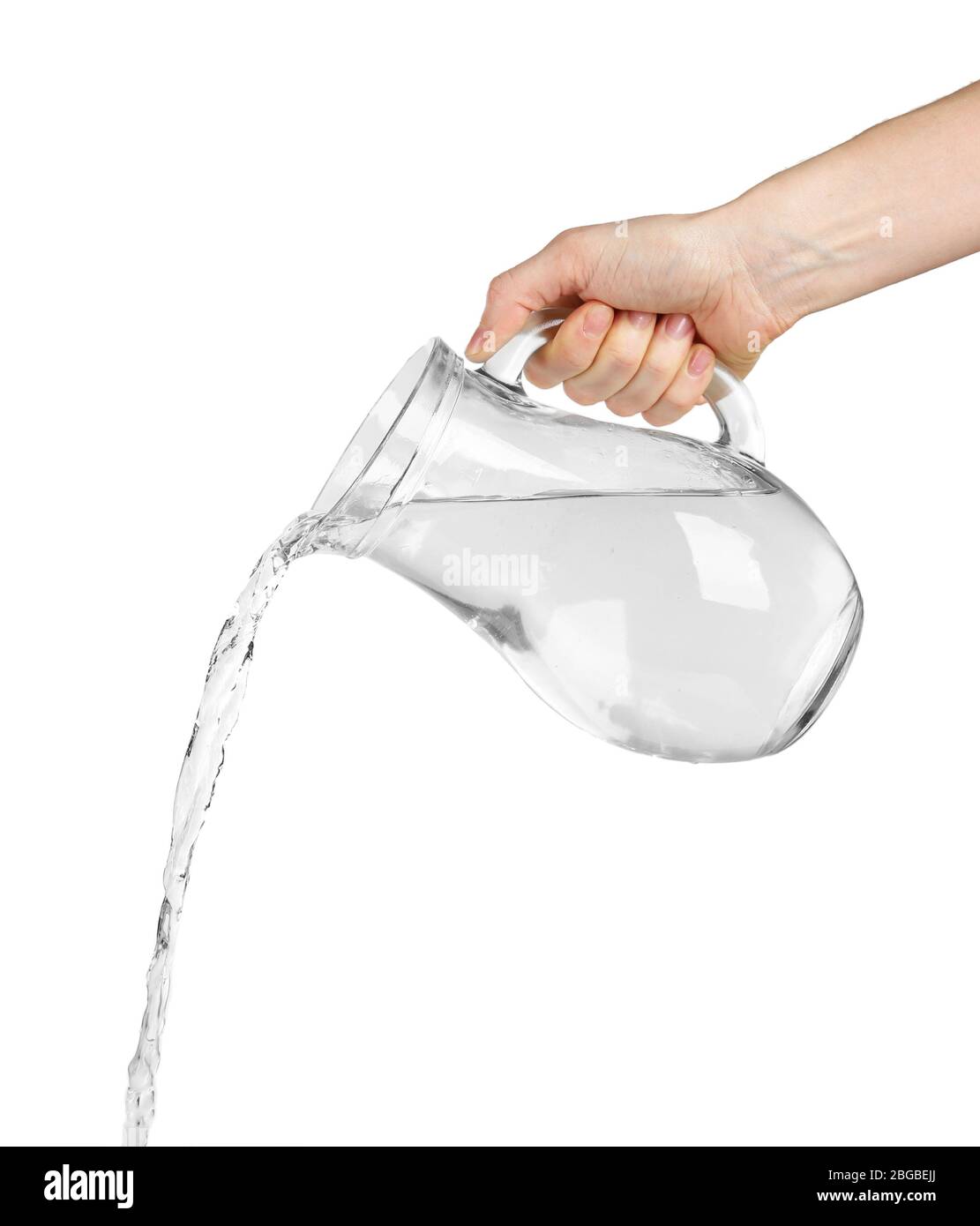 Pouring water from glass pitcher, isolated on white Stock Photo - Alamy