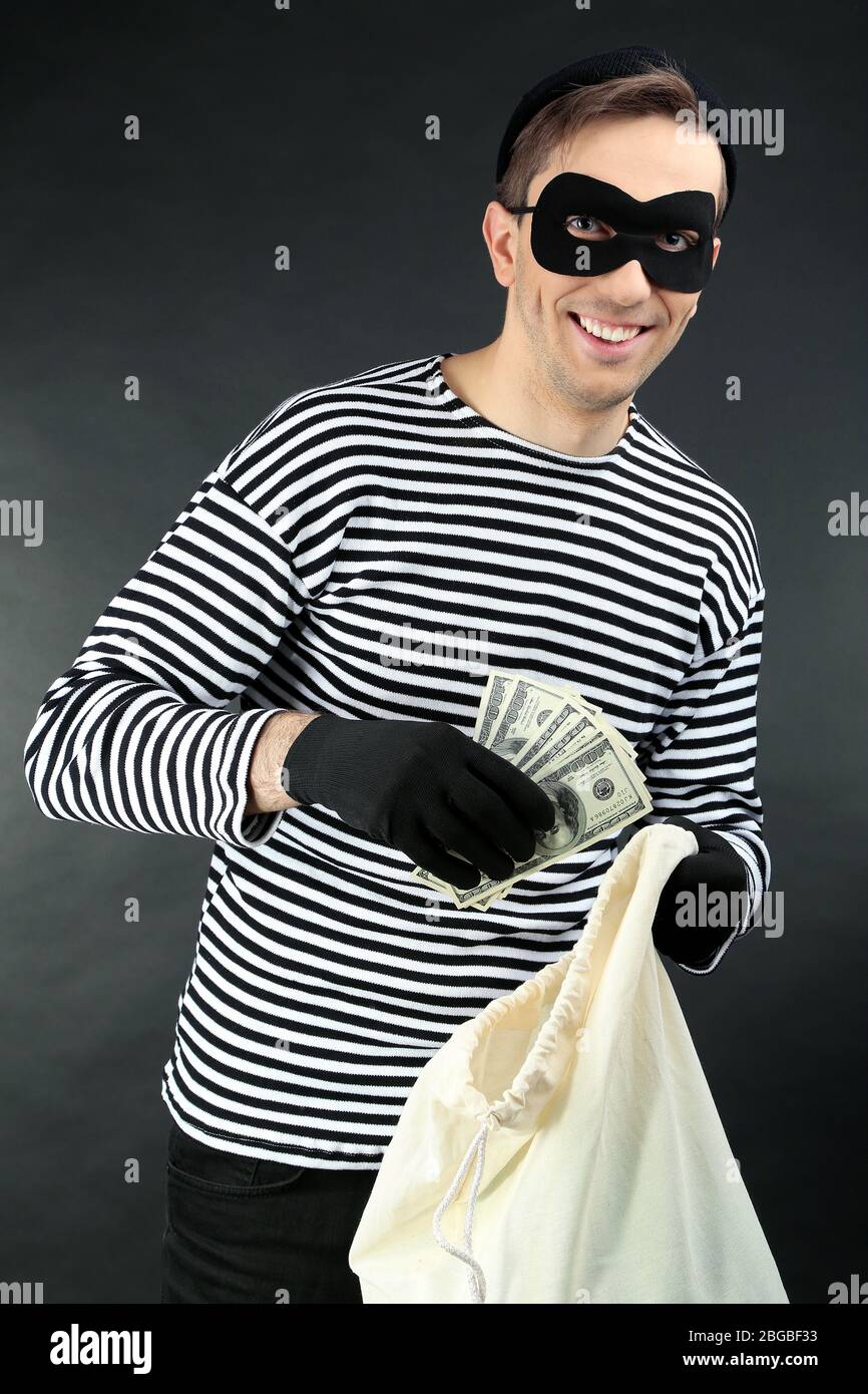Robbing money bag hi-res stock photography and images - Alamy