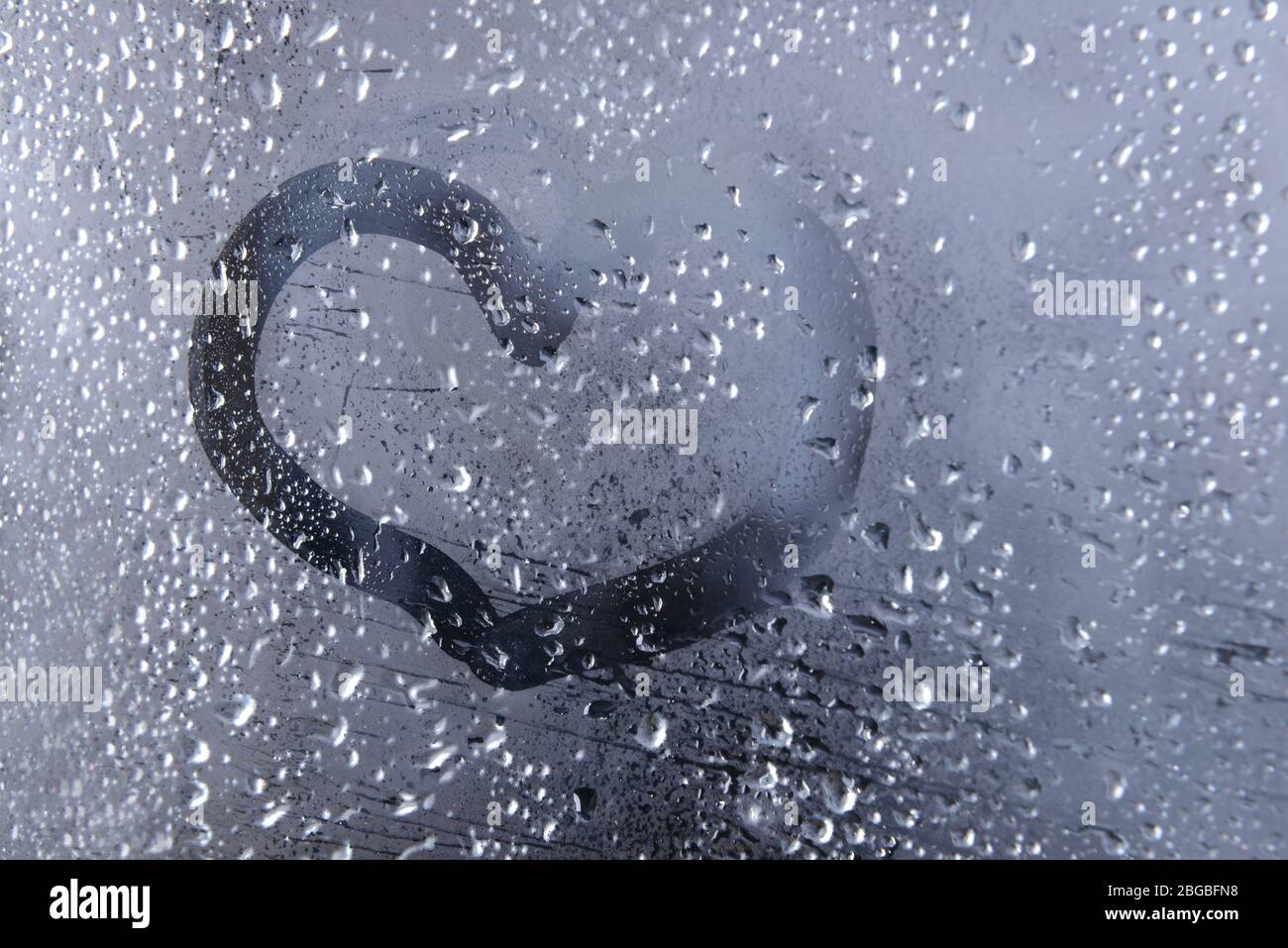 Drawn heart on wet window close-up Stock Photo - Alamy