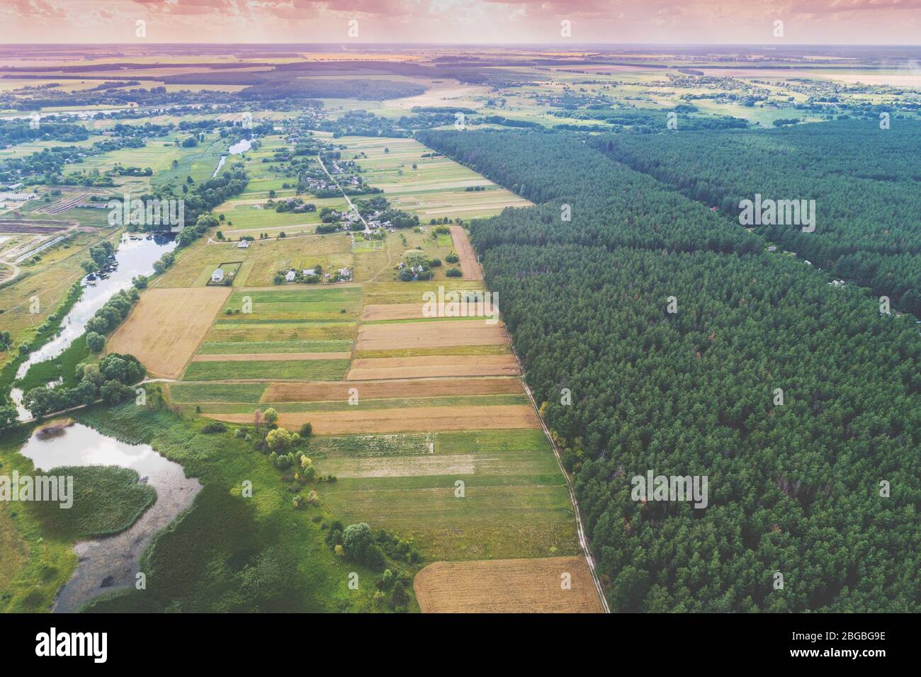 Rural landscape with a beautiful sky. Bird's-eye. River, lake, fields ...