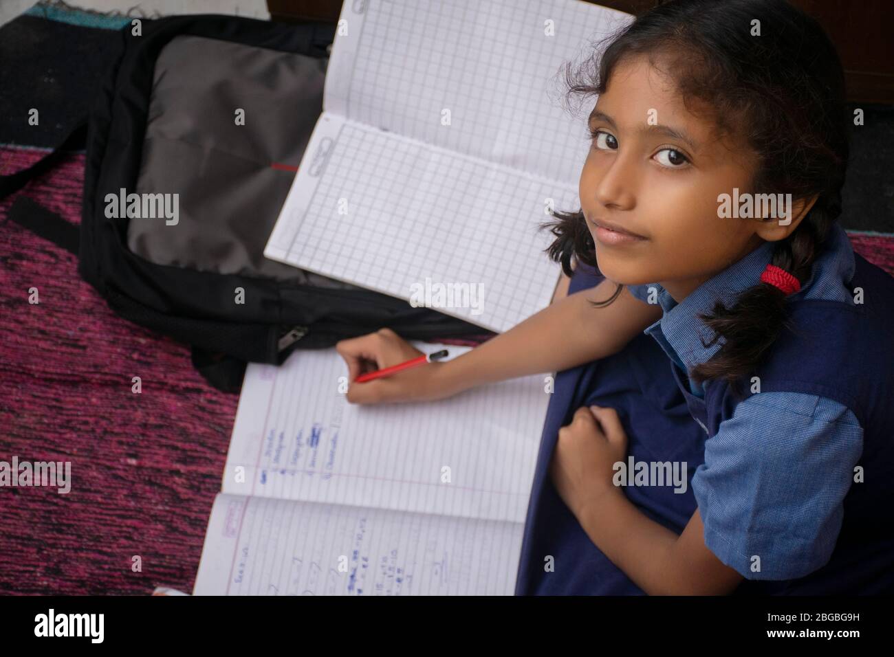 school girl reading and writing book , top view Stock Photo - Alamy