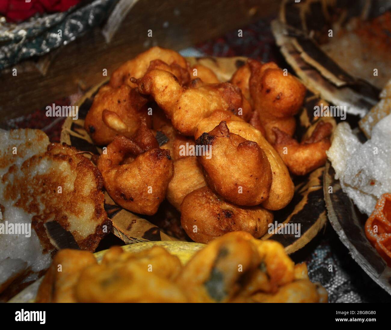 sweet Pakoda, Crispy pakore, Indian snack served in disposable plate ...