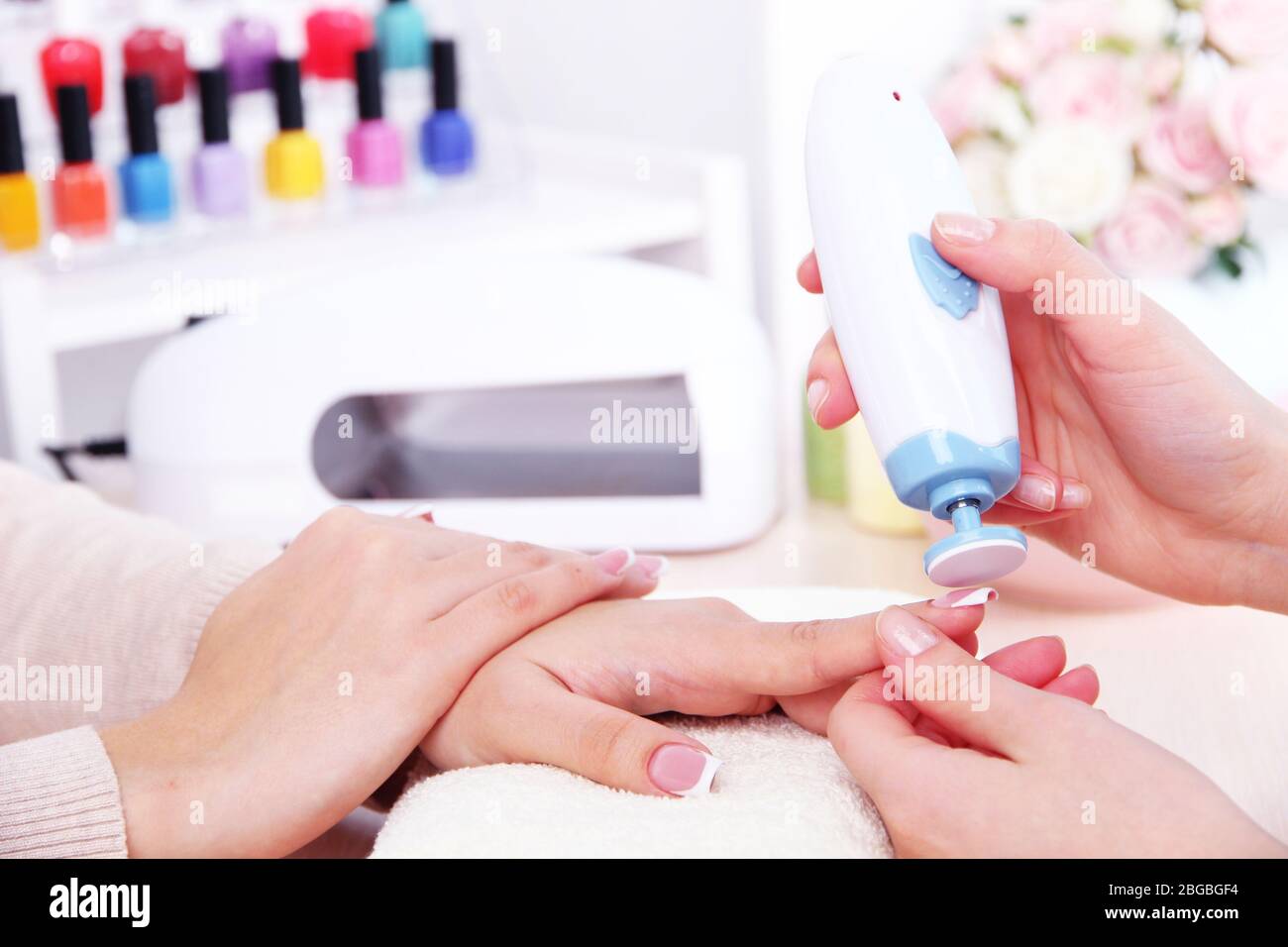 Manicure process in beauty salon close up Stock Photo - Alamy