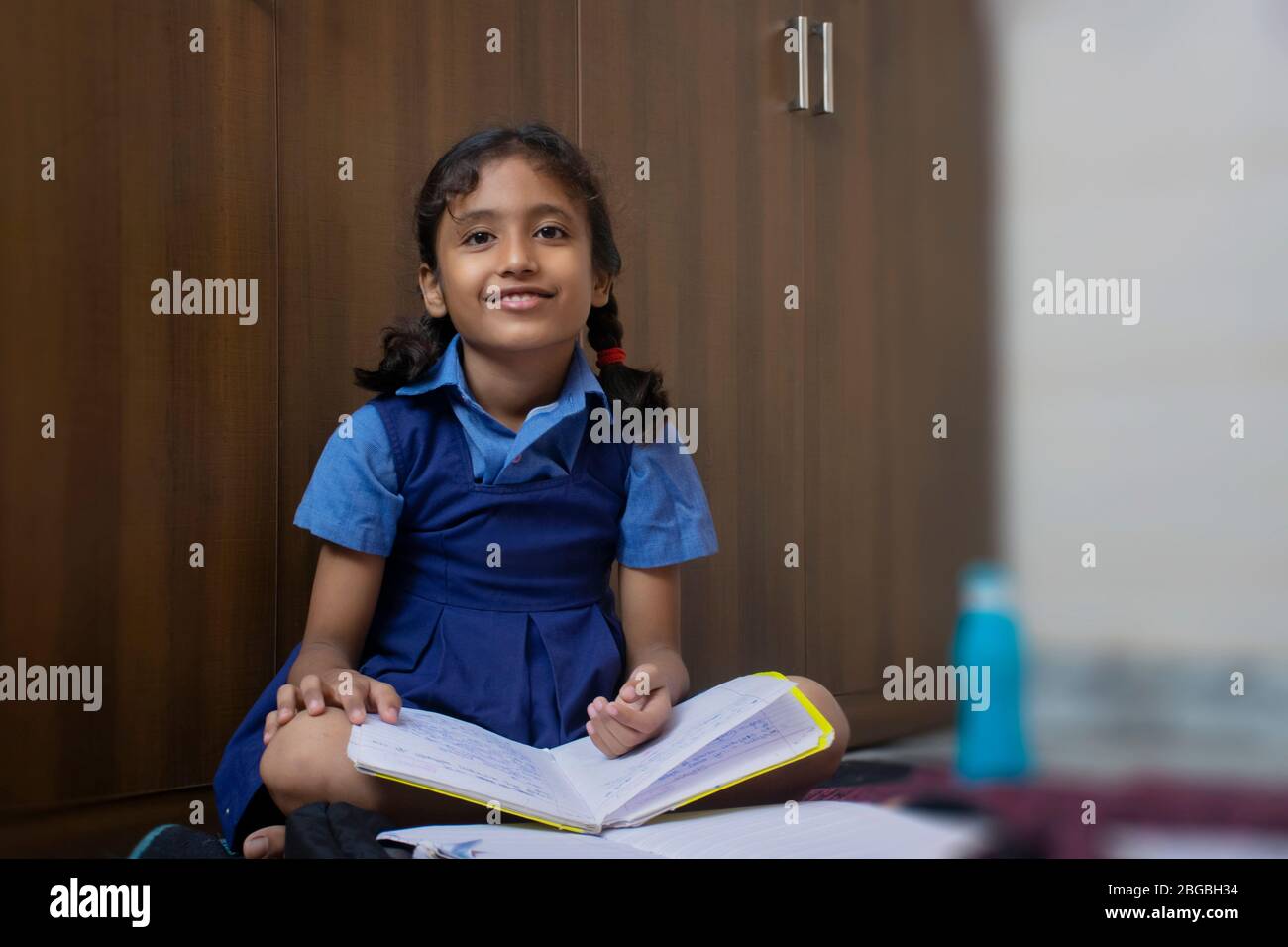 Indian school girl looking at camera Stock Photo - Alamy