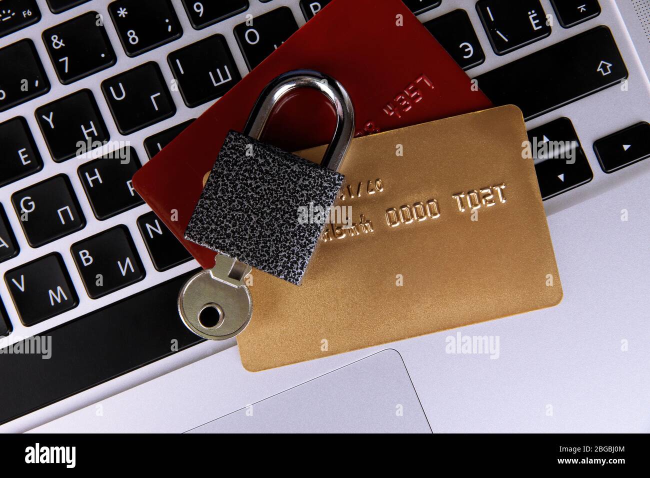 Credit cards and lock on keyboard close up Stock Photo - Alamy