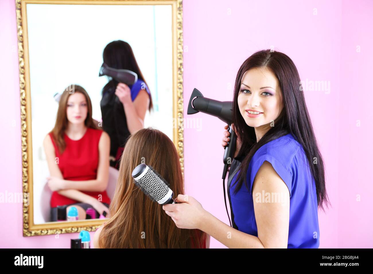 Beautiful woman hairdresser do hairstyle girl in beauty salon Stock ...