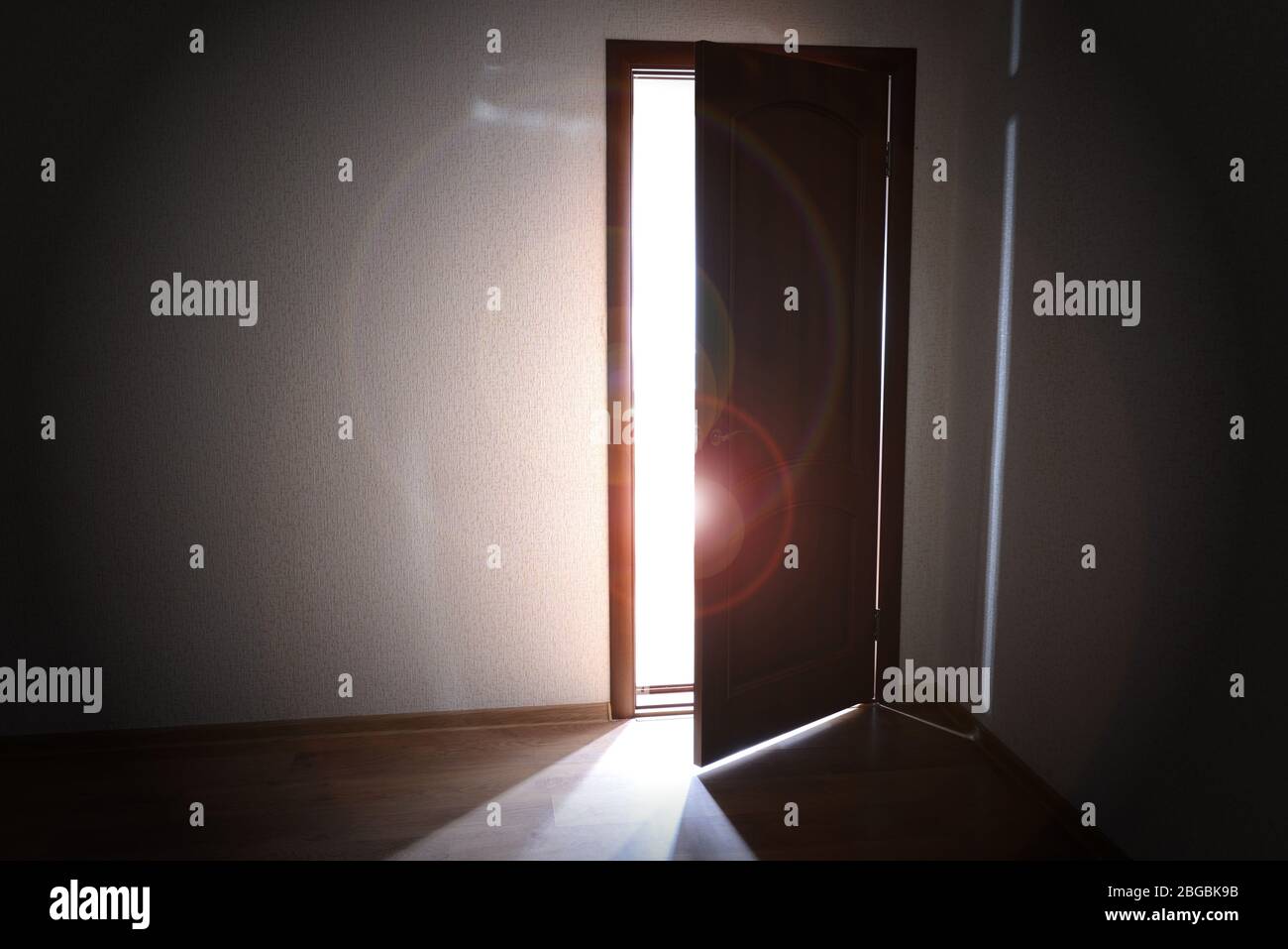 Open door with bright light outside Stock Photo - Alamy