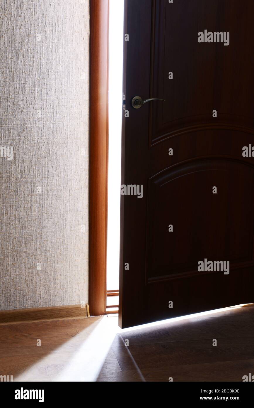 Open door with bright light outside Stock Photo - Alamy