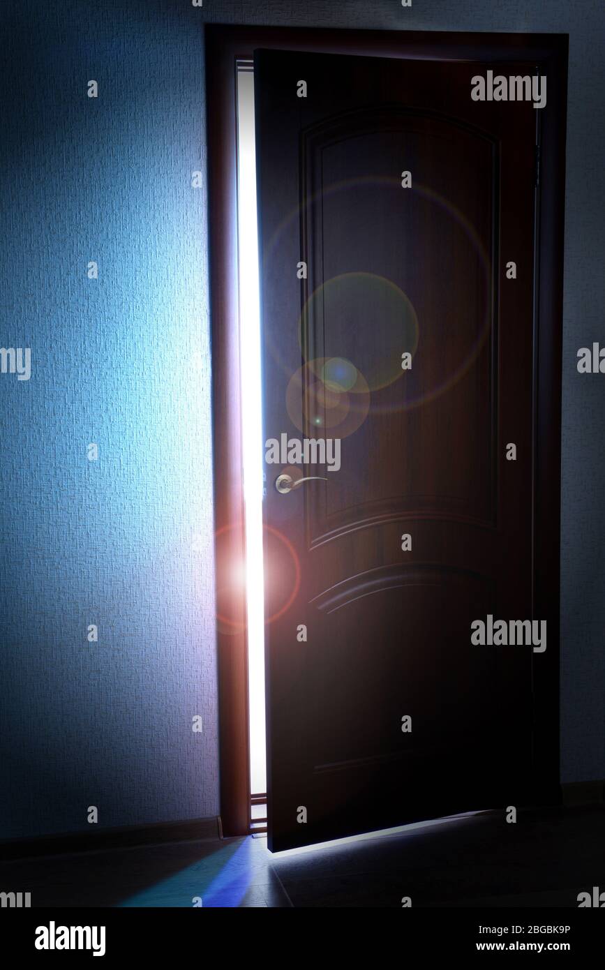 Open door with bright light outside Stock Photo - Alamy